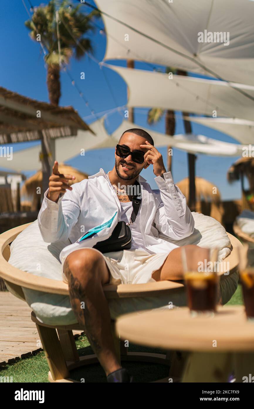 A beautiful shot of a young Caucasian man posing for the camera at the ...