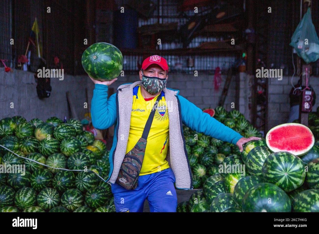 Watermelon seller, poses smiling before the lens, assuring that with ...