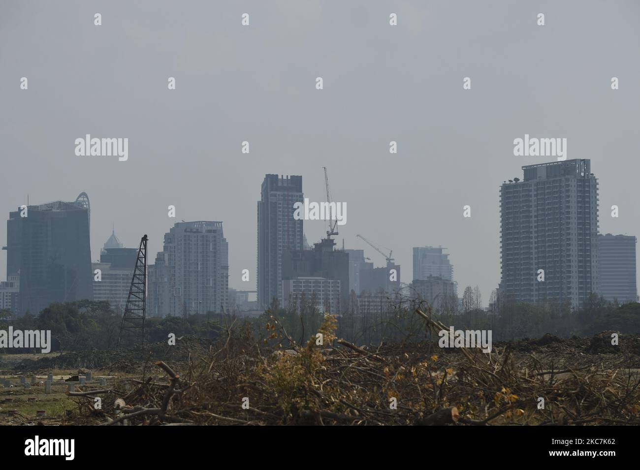 Heavy air pollution of fine particulate matter (PM2.5) shrouds a street ...
