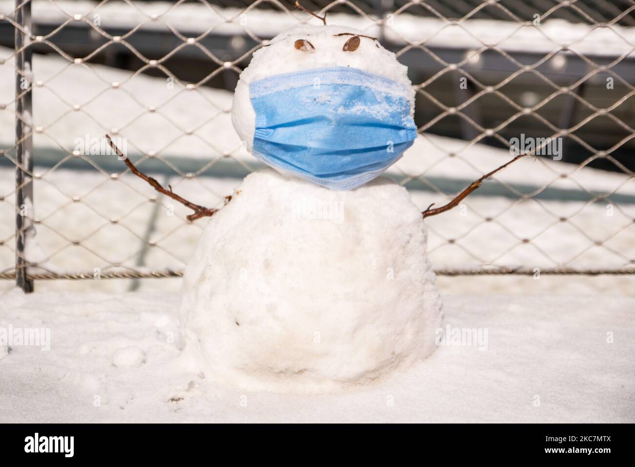 A COVID-19 compliant snowman with a medical facemask as seen in the ...