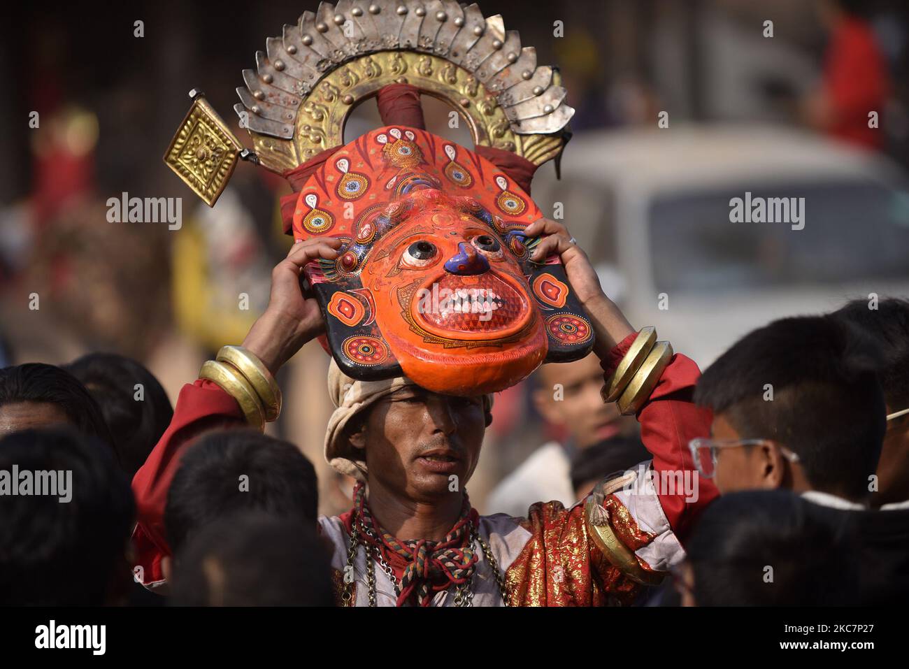 A Nepalese person impersonate as a deity carry mask after performing ...