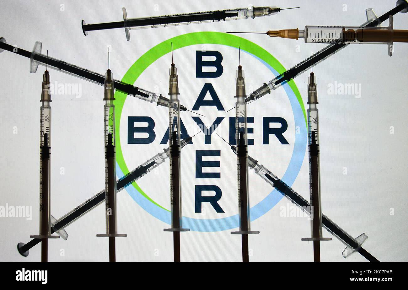 An illustrative image of medical syringes in front of a Bayer logo ...