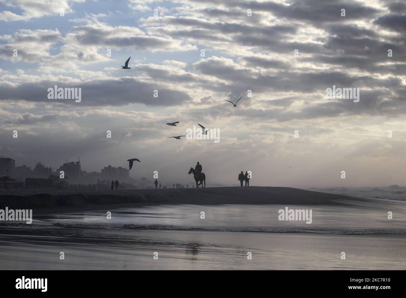 Palestinians enjoy on gaza beach during sunset, on January 18, 2021 ...