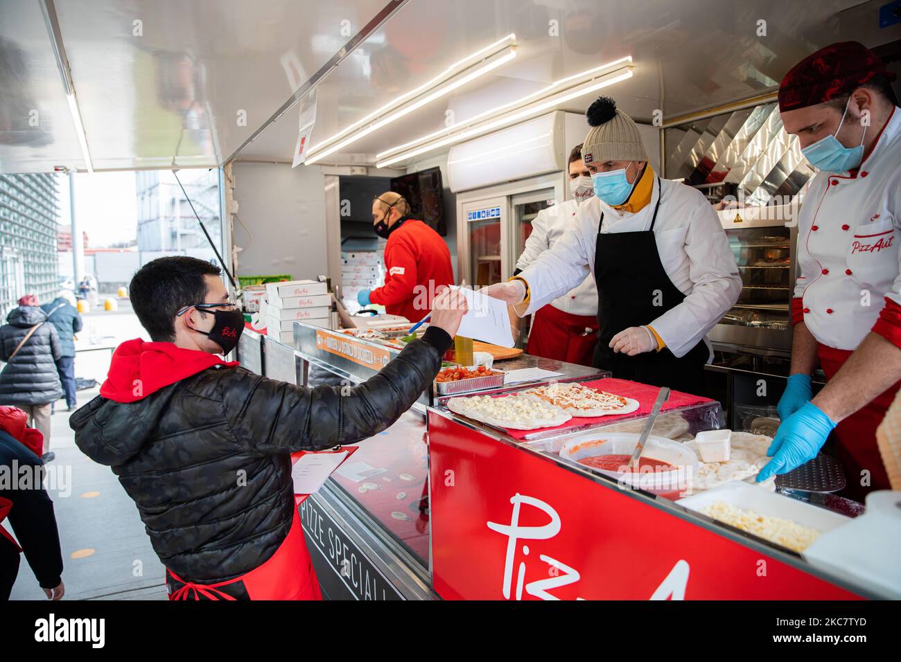 The staff of PizzAut, pizzeria run by autistic guys, prepares and ...