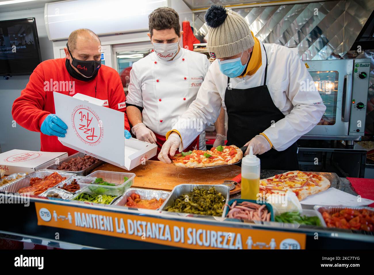 The staff of PizzAut, pizzeria run by autistic guys, prepares and ...