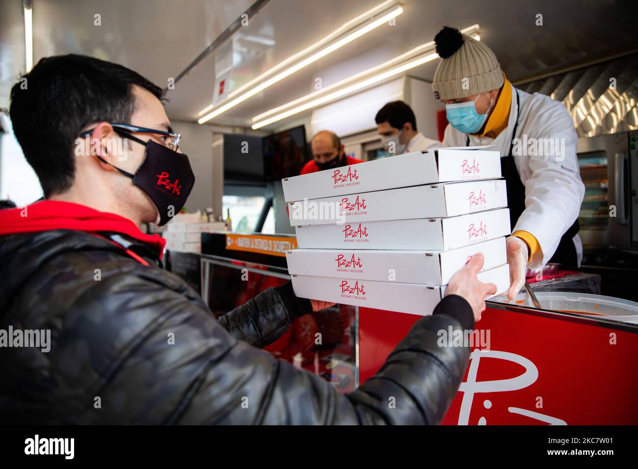 The staff of PizzAut, pizzeria run by autistic guys, prepares and ...