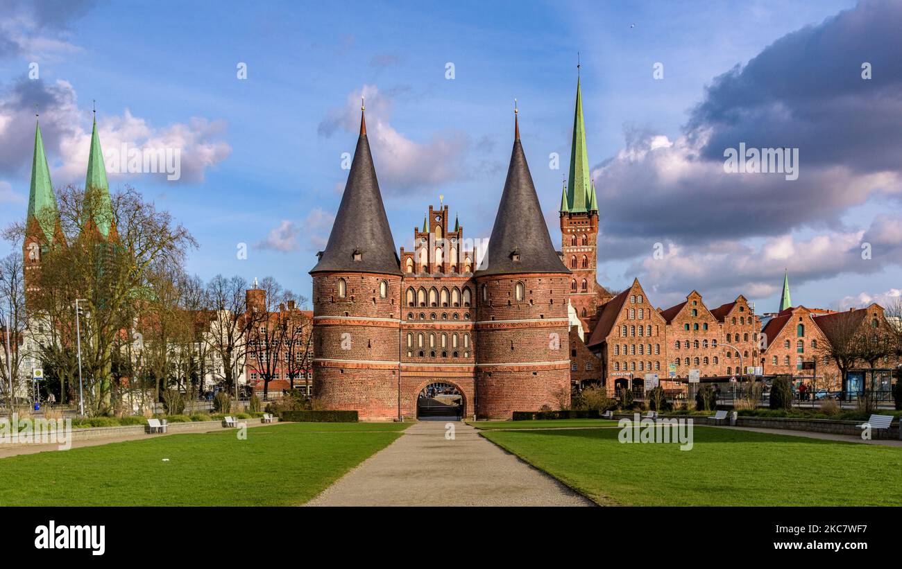 The medieval Holsten Gate in Lubeck, Germany against a beautiful blue ...