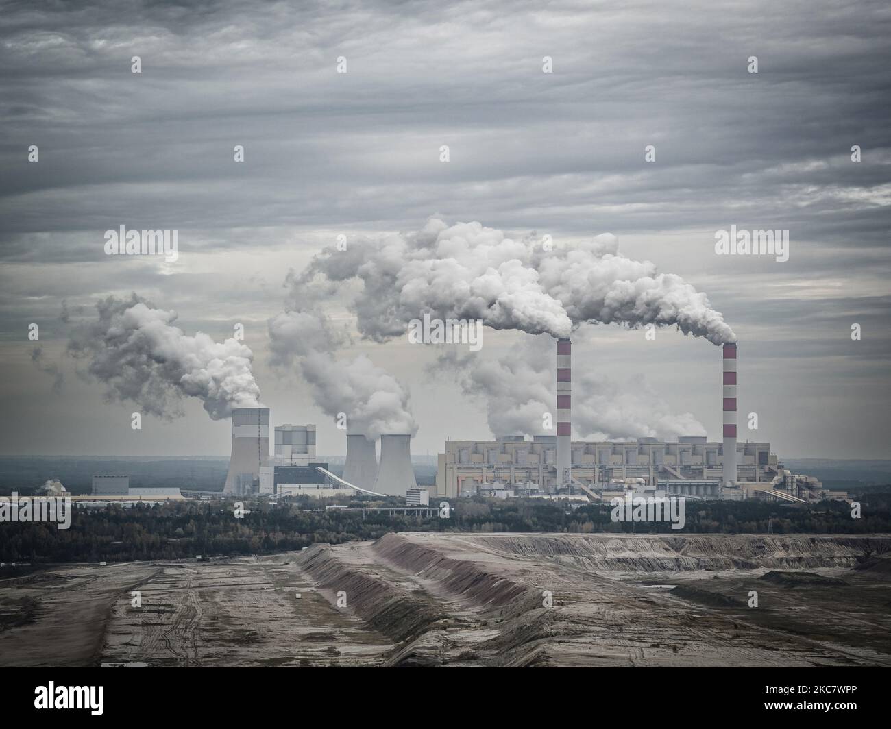 Aerial view of power plant and open-cast coal mine in Belchatow under ...