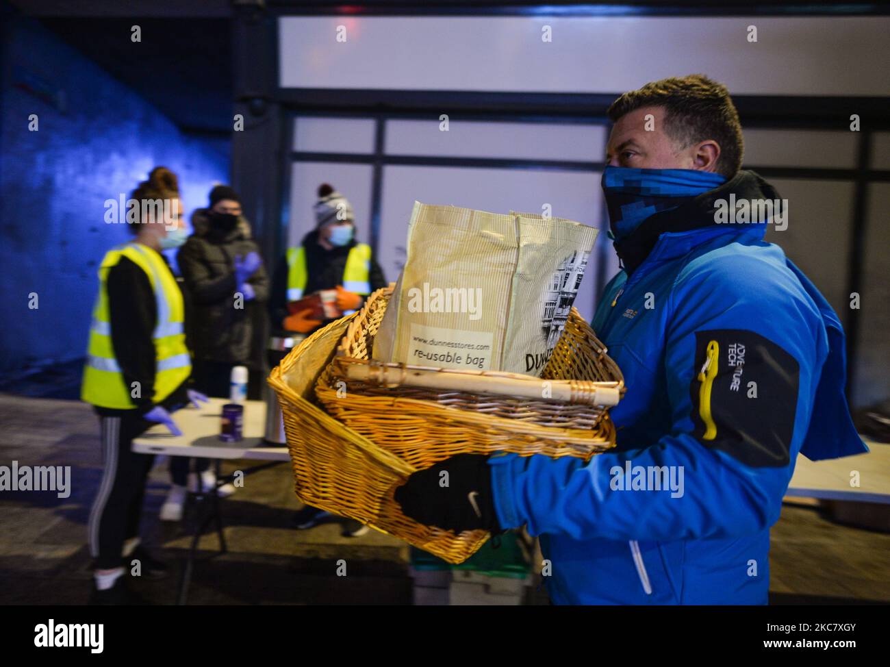 A group of volunteers from the Homeless Mobile Run distributing hot ...