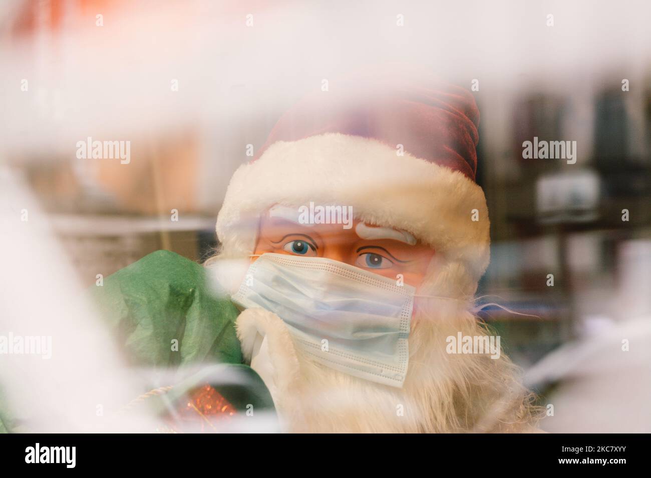A santa claus with face mask is seen being locked inside a closing ...