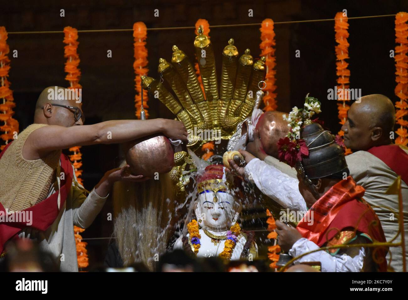 Nepalese Priests perform an annual ritual bathing ceremony of Seto Machindranath in Janabahal ...
