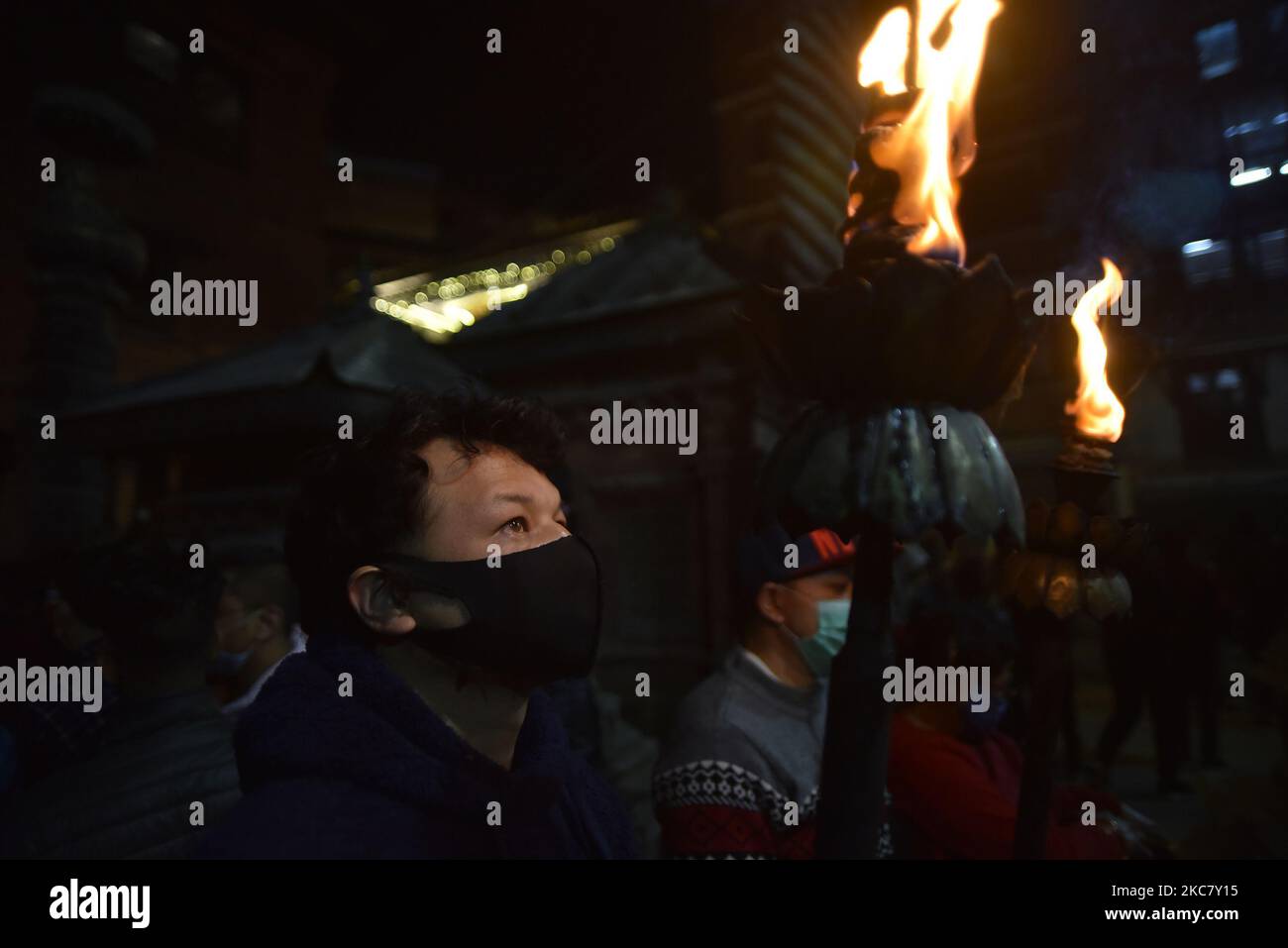 Nepalese devotee hold oli torch light during an annual ritual bathing ...