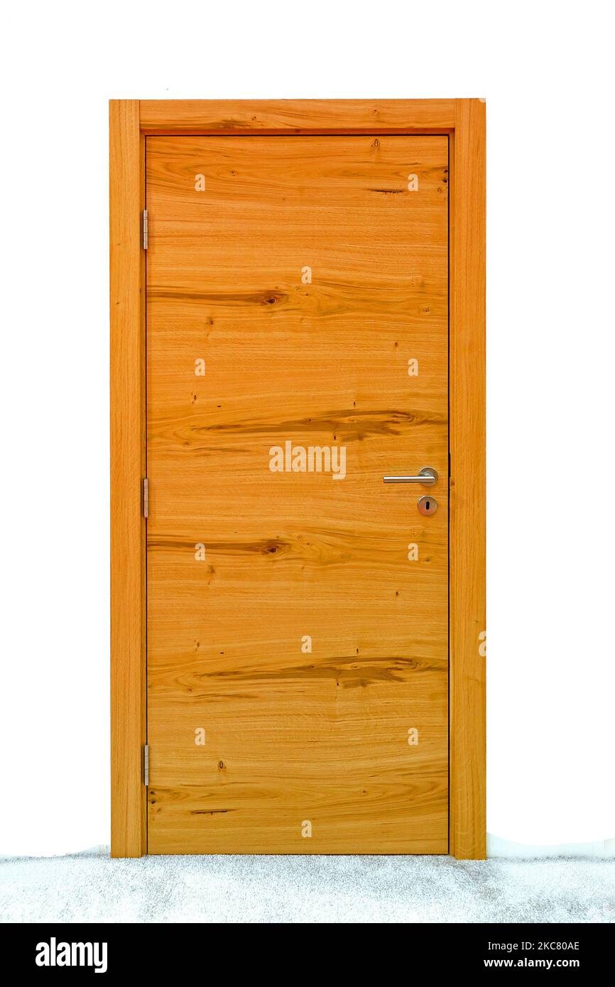 Closed brown wooden door inside interior corridor wall Stock Photo - Alamy