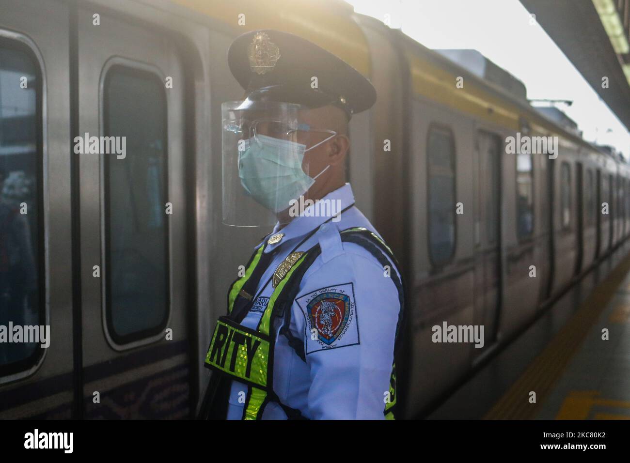 Security guard of LRT-2 in Santolan Station, Pasig City wearing face ...