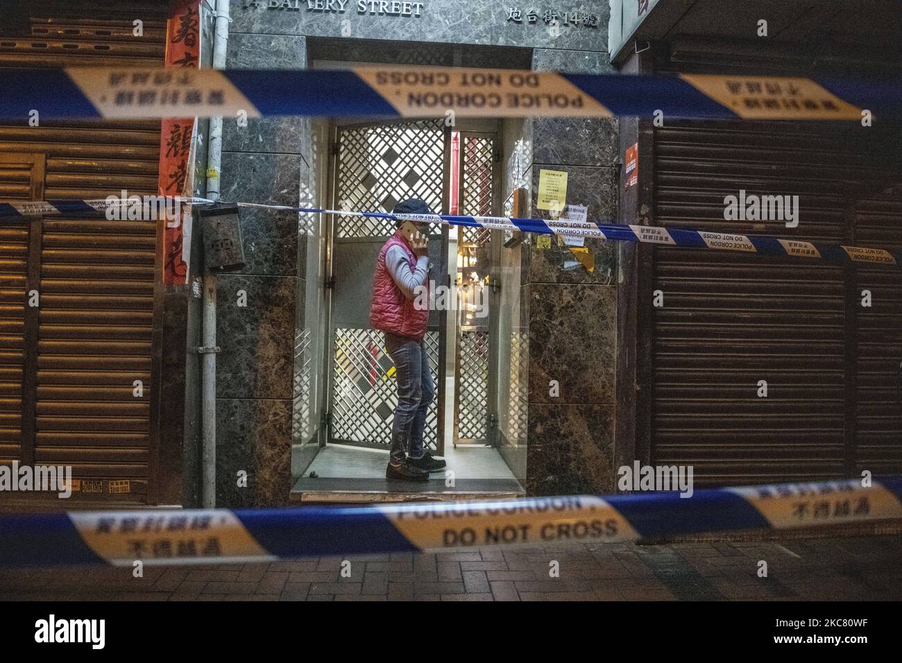 A Resident is seen entering her home inside the lockdown area on ...
