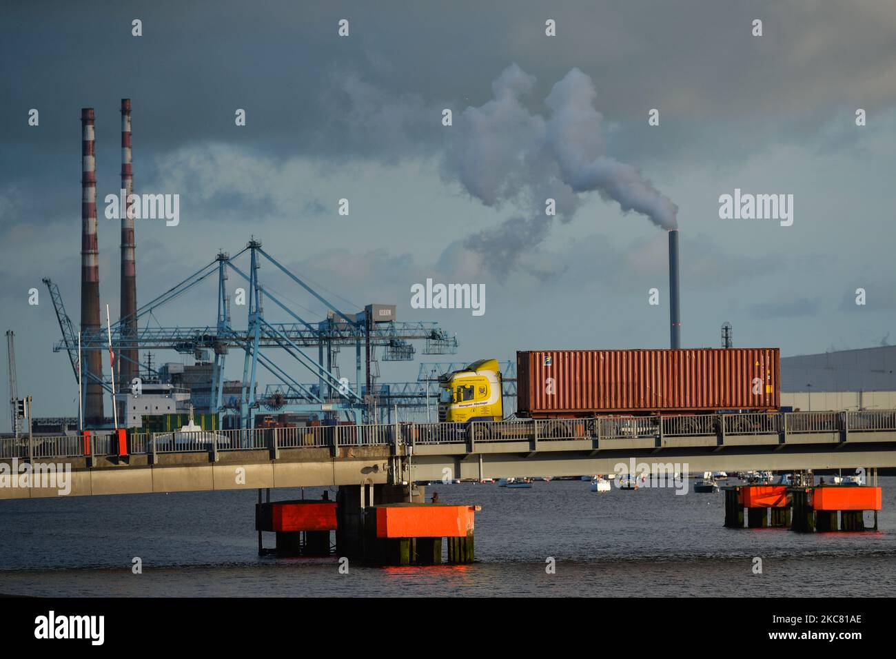 A lorry seen on Tom Clarke Bridge with a view of Dublin port in the ...