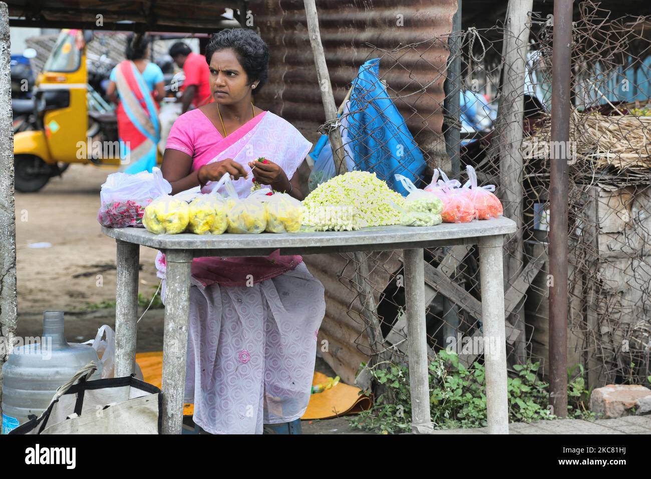 Woman sells flowers at the Melmaruvathur Amman Temple located in ...