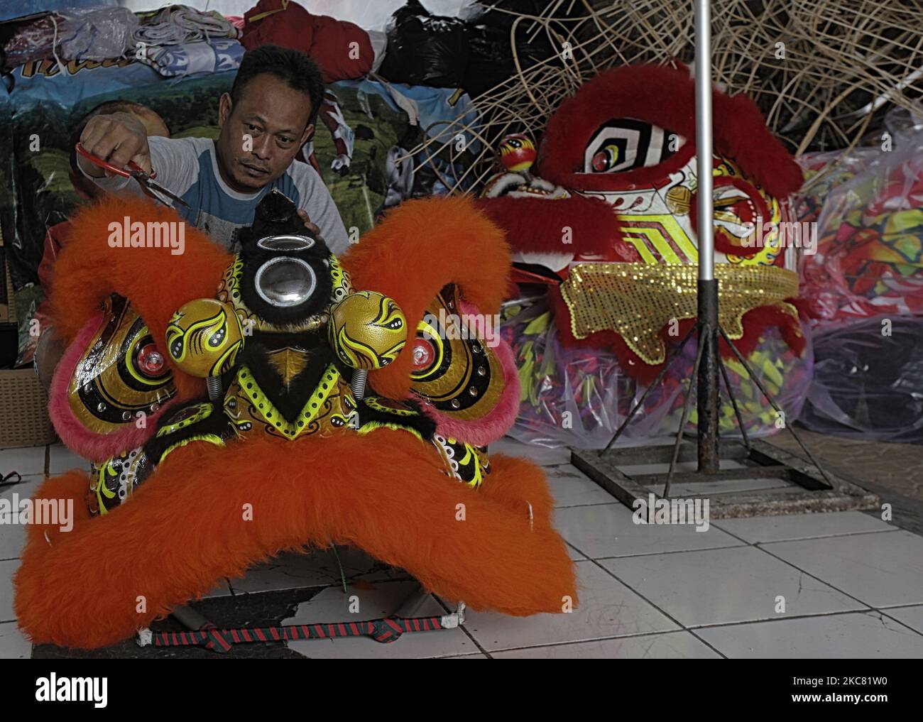 Lili Hambali, 49, a maker of lion (Barongsai) and Liong (dragon) dance ...