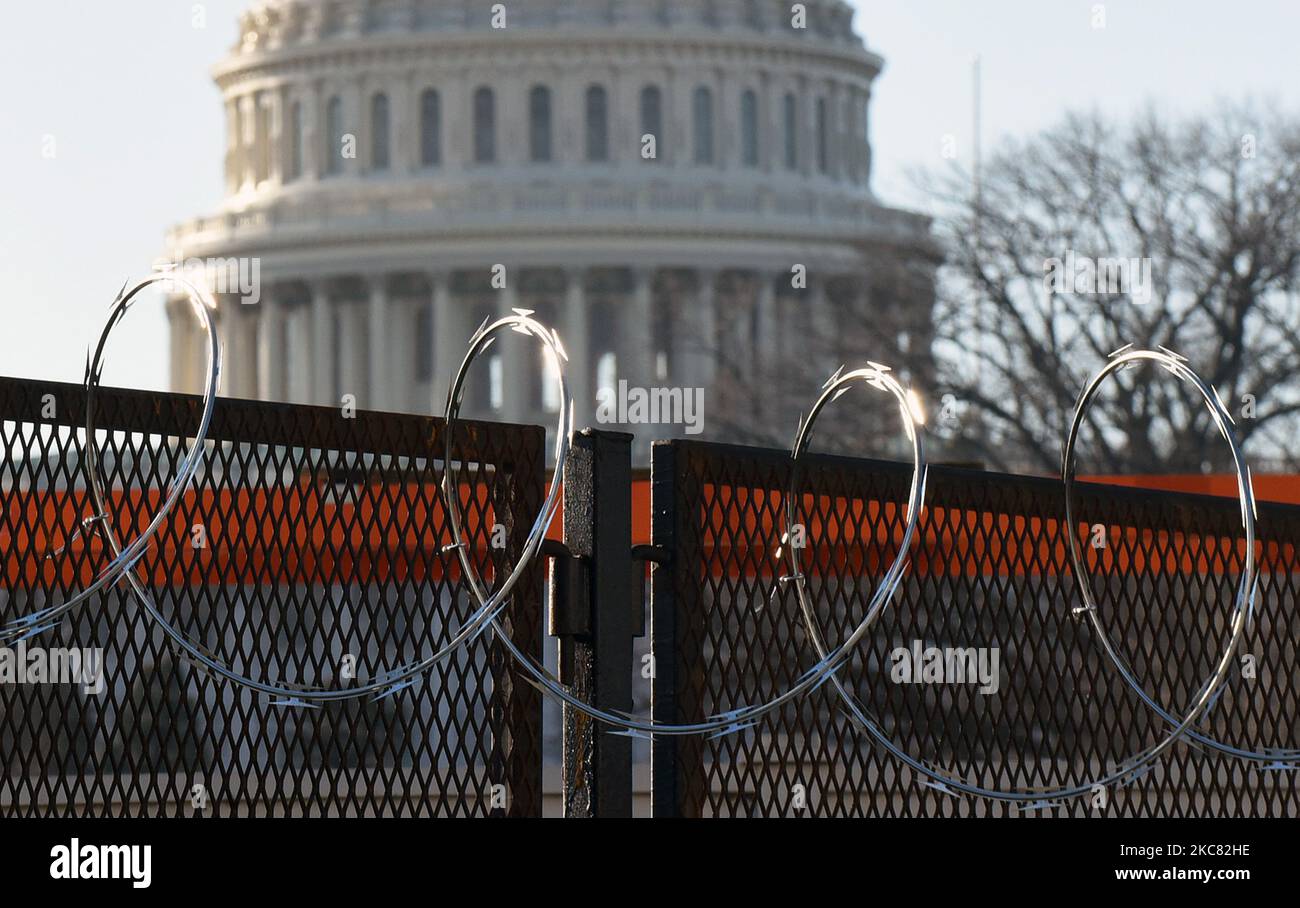 Razor wire tops the fence surrounding the U.S Capitol two days after ...