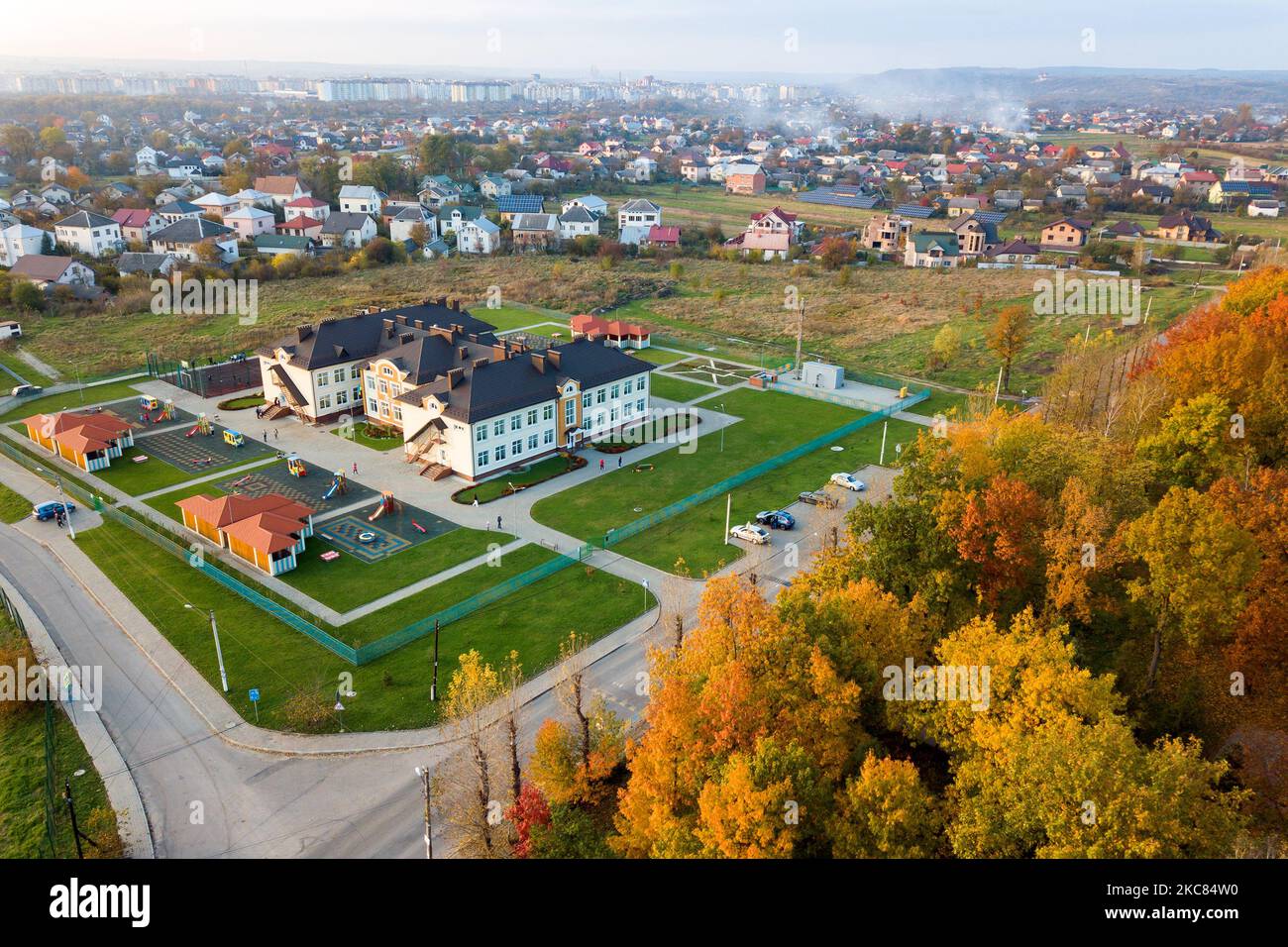 Aerial view of school, college or kindergarten building with big yard ...