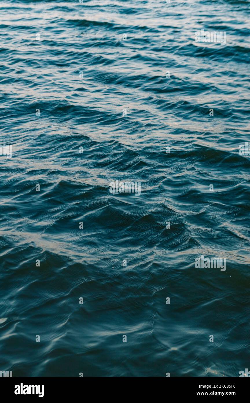 A vertical shot of ocean waves with shades of blue - great for ...