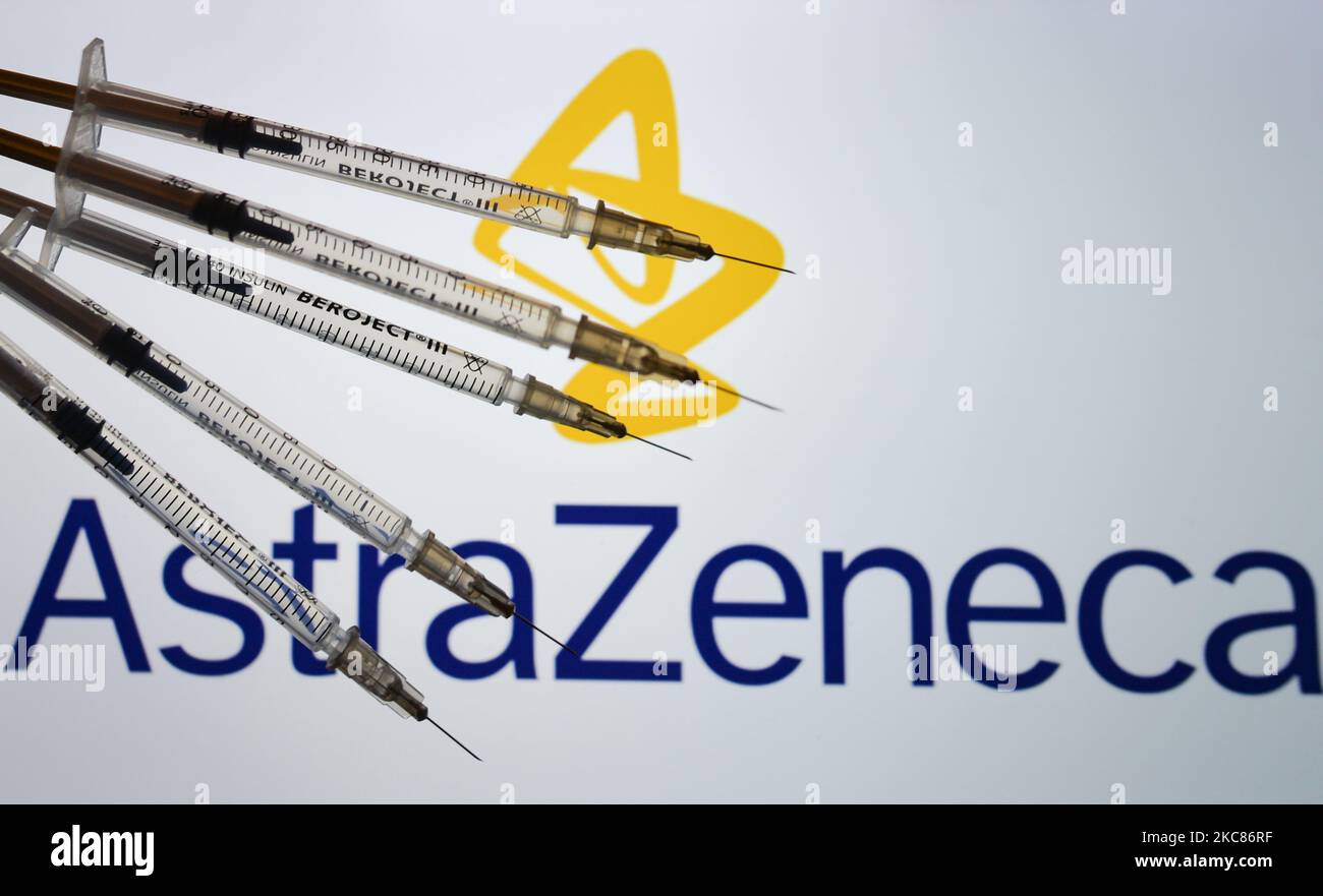 An illustrative image of medical syringes in front of an AstraZeneca ...