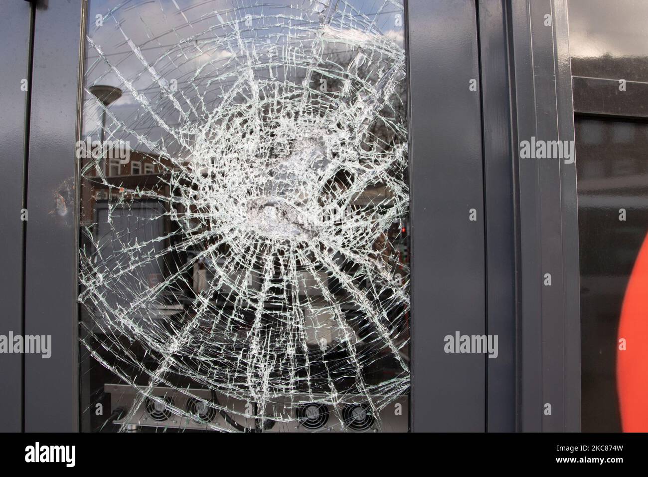 The aftermath of the anti-curfew unrest in Rotterdam. Damaged windows ...