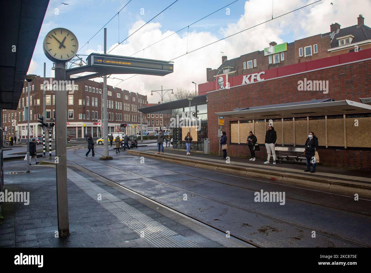 Randweg tram stop with the broken windows covered with wood panels ...
