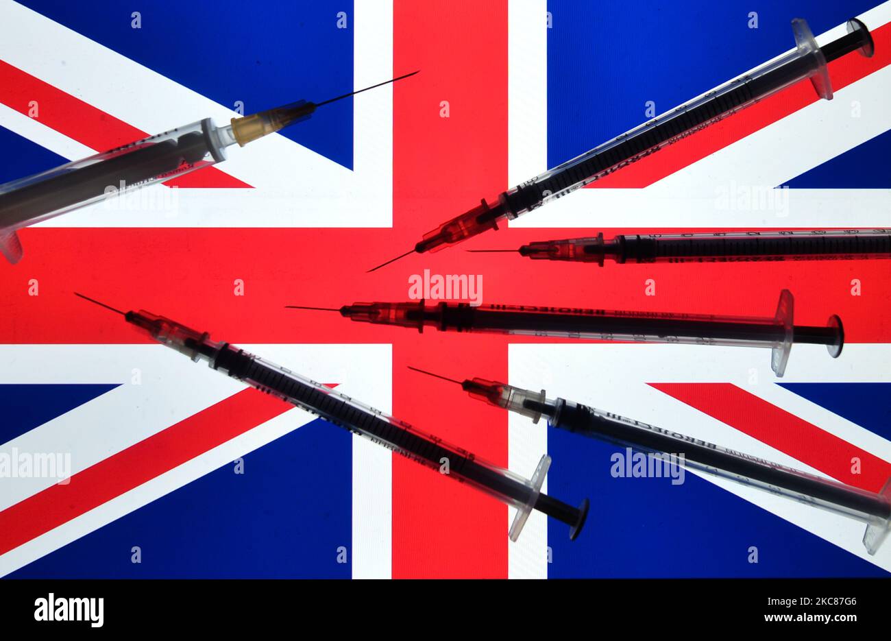 An illustrative image of medical syringes in front of the United ...