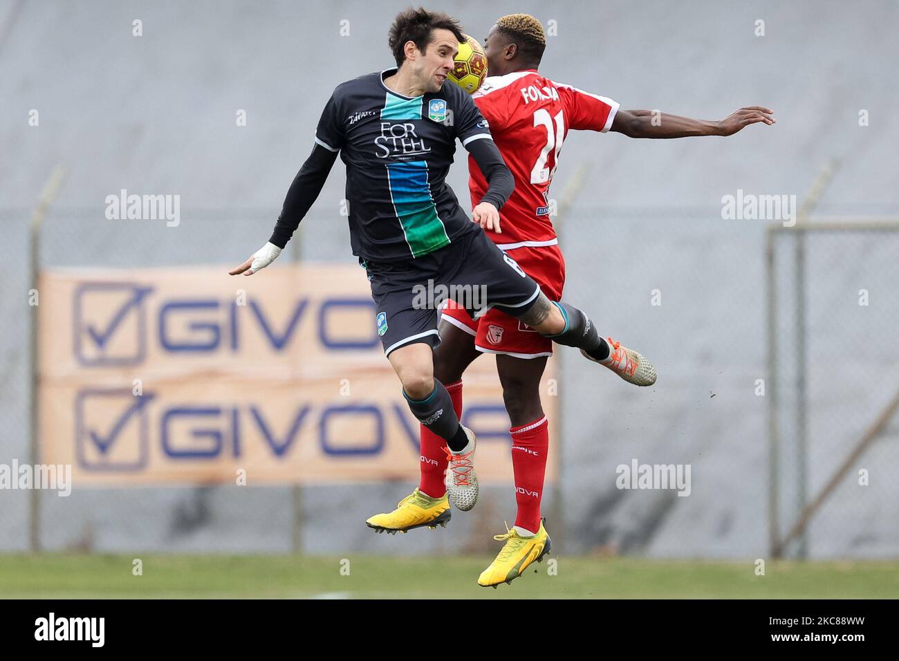 Luca guidetti of feralpisalo and lamine fofana of carpi fc hi-res stock ...