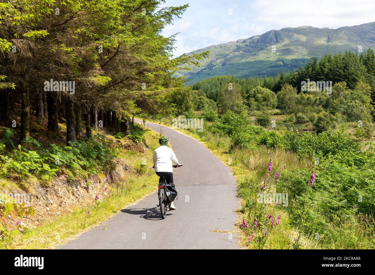 Model released middle aged woman rides electric bike in Scotland on the ...