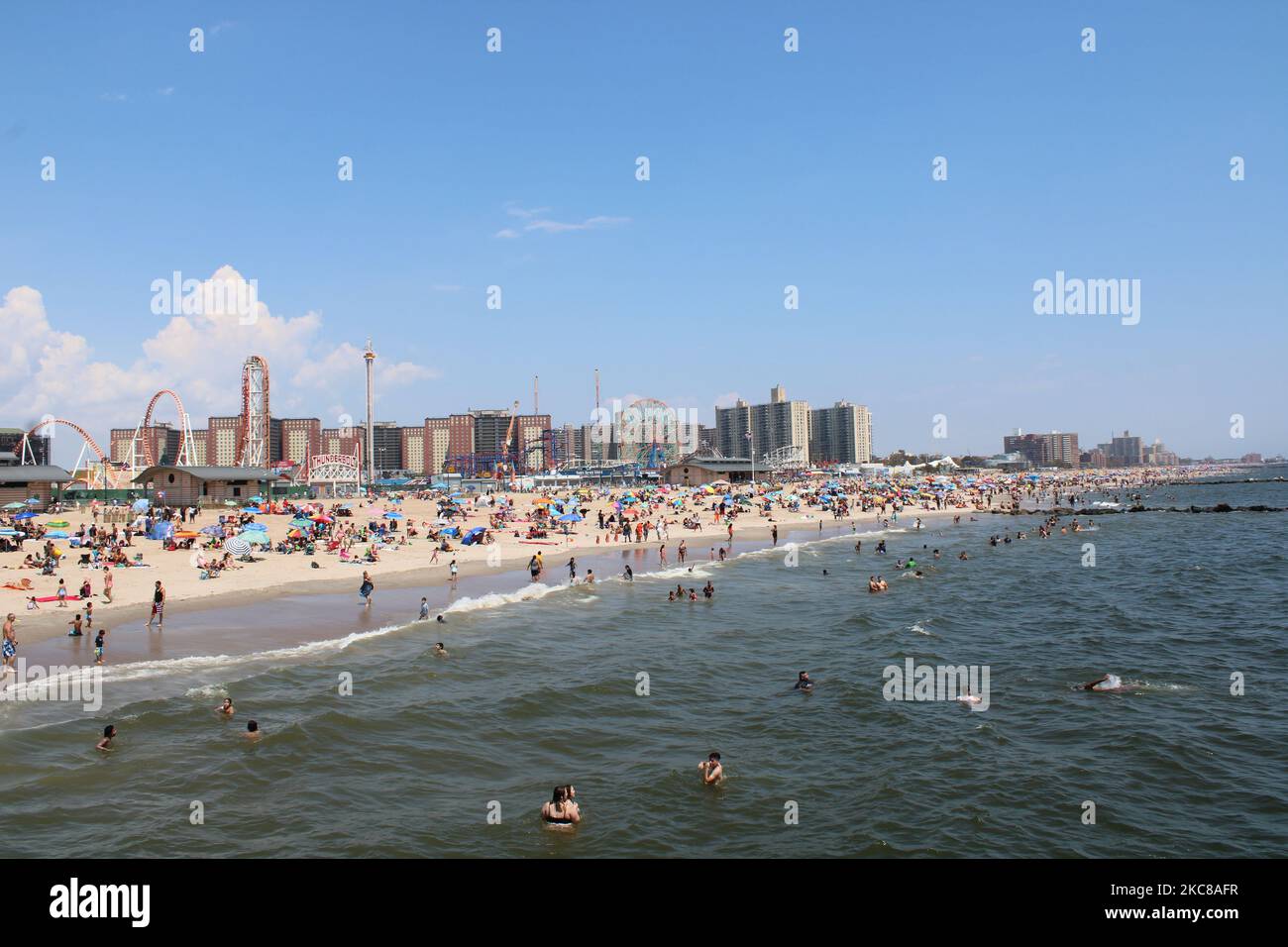 The crowded Coney Island Beach on a sunny day in New York, US Stock ...
