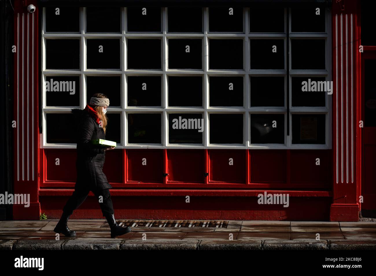 A woman wearing a face mask seen walking in Dublin city center during ...
