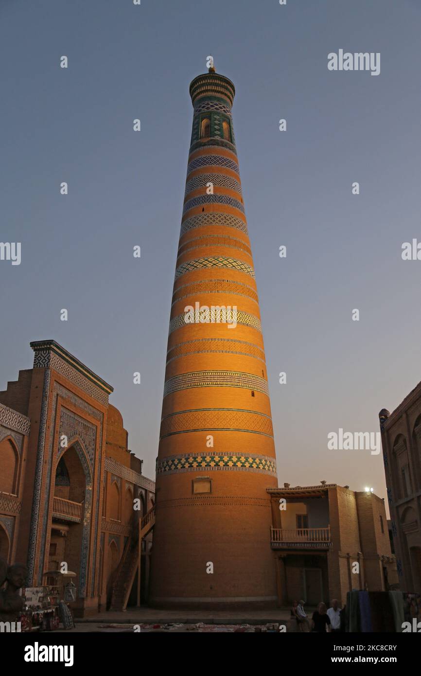 Islam Khoja Madrasa and Minaret at sunset, Ichan Kala (Inner Fortress ...