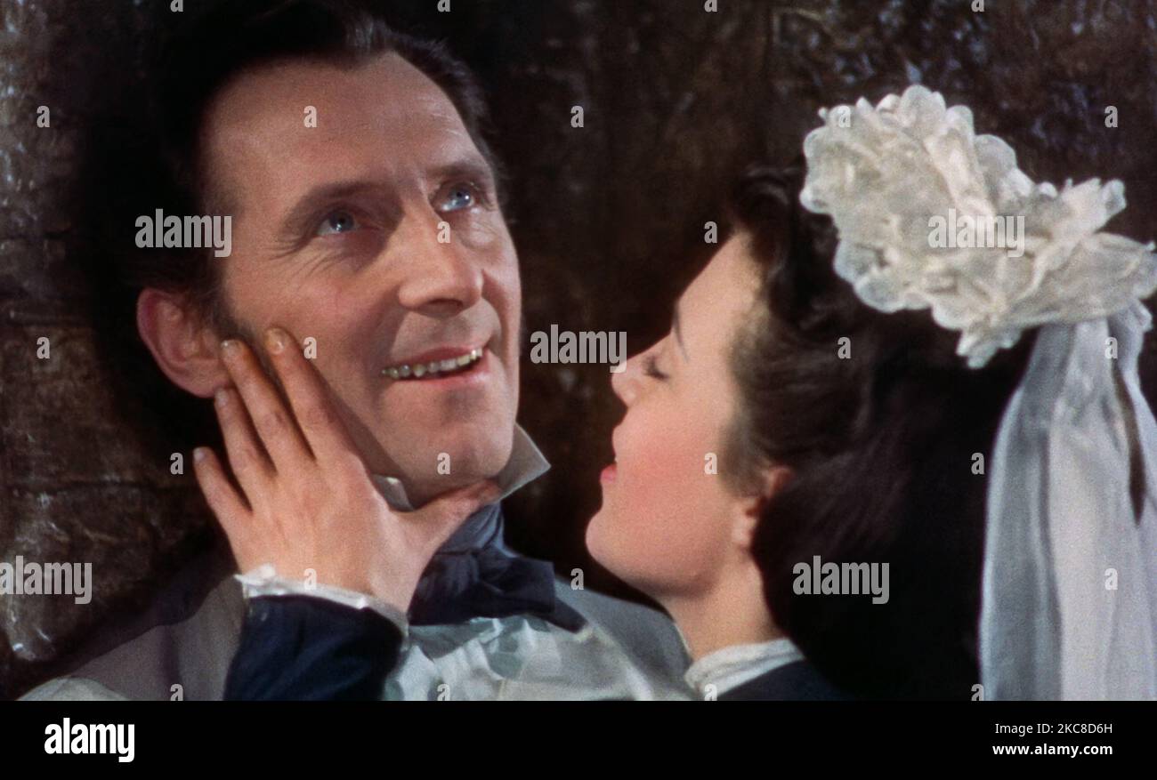 USA. Valerie Gaunt and Peter Cushing in a scene from the (C)Warner Bros ...