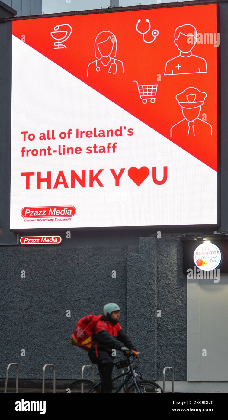 A street billboard 'Thank You, to all of Ireland's front-line staff ...