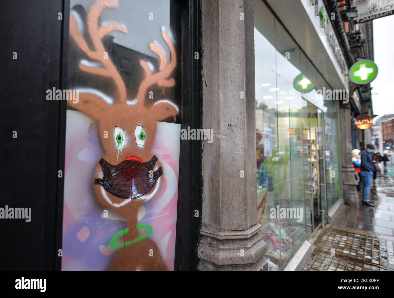 An image of Rudolph, a red-nosed reindeer with a face mask, painted in ...