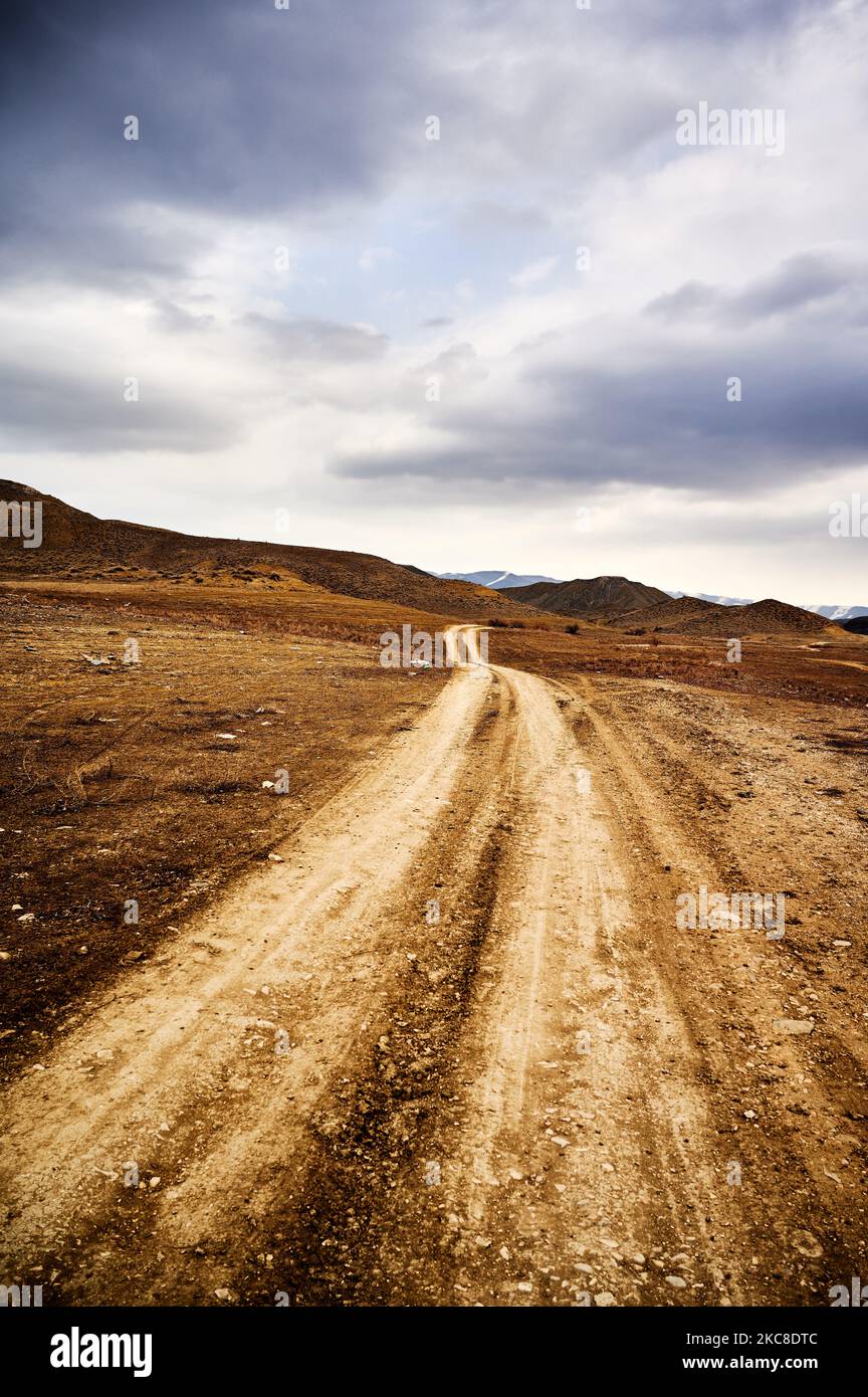 A vertical view of a narrow pathway passing through a soil field Stock ...