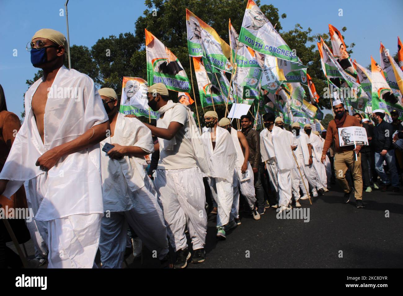 Indian Youth Congress (IYC) activists dressed as Mahatma Gandhi, taking ...