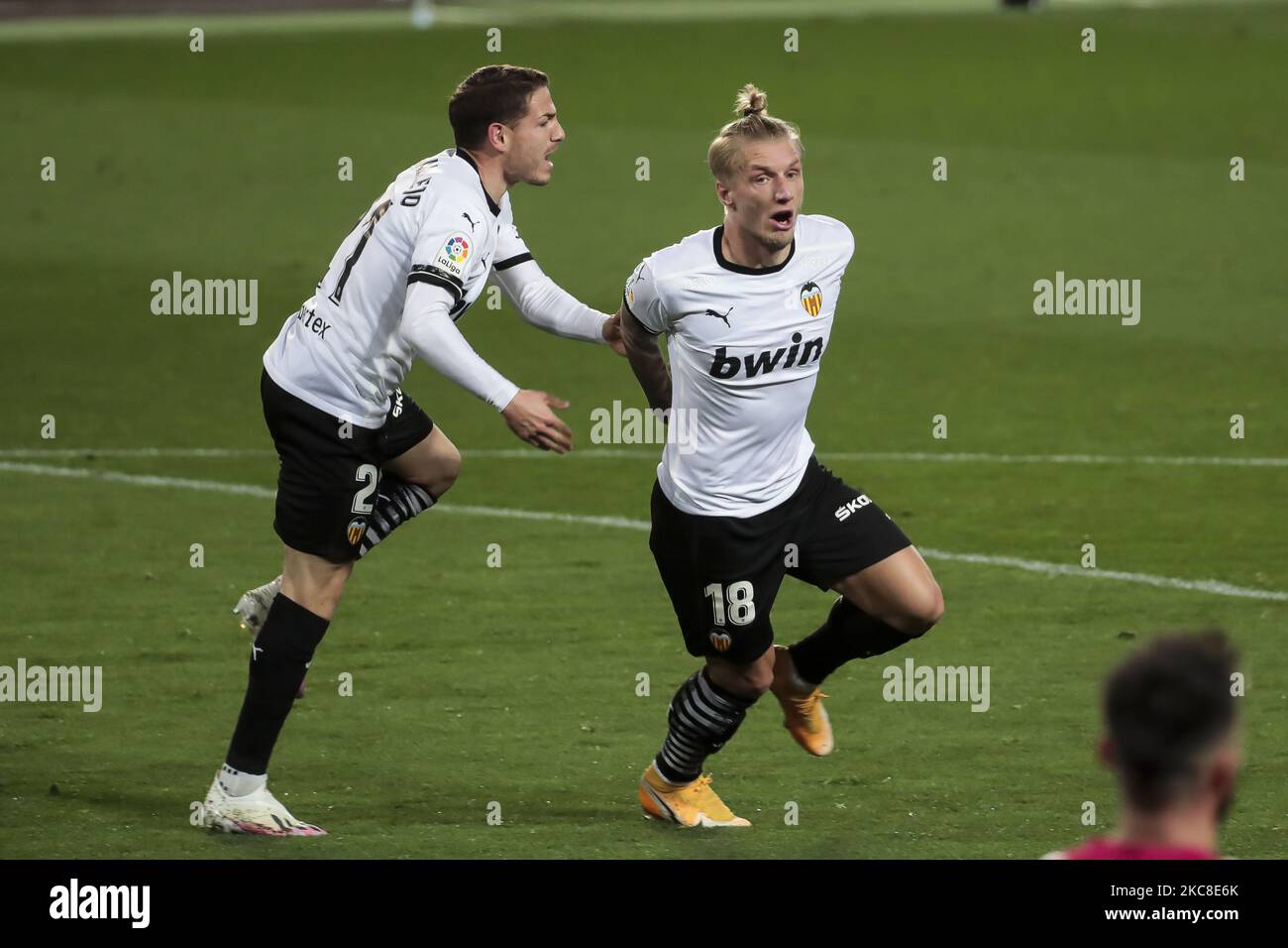Daniel Wass of Valencia CF (R) celebrate after scoring the 1-0 goal ...