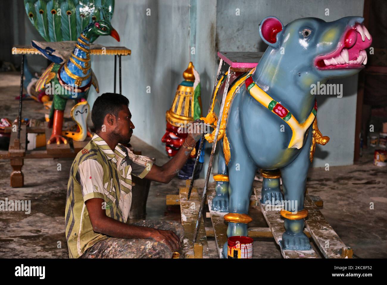 Artisan paints a large Vahana of a rat the Arasadi Vinayagar Temple ...