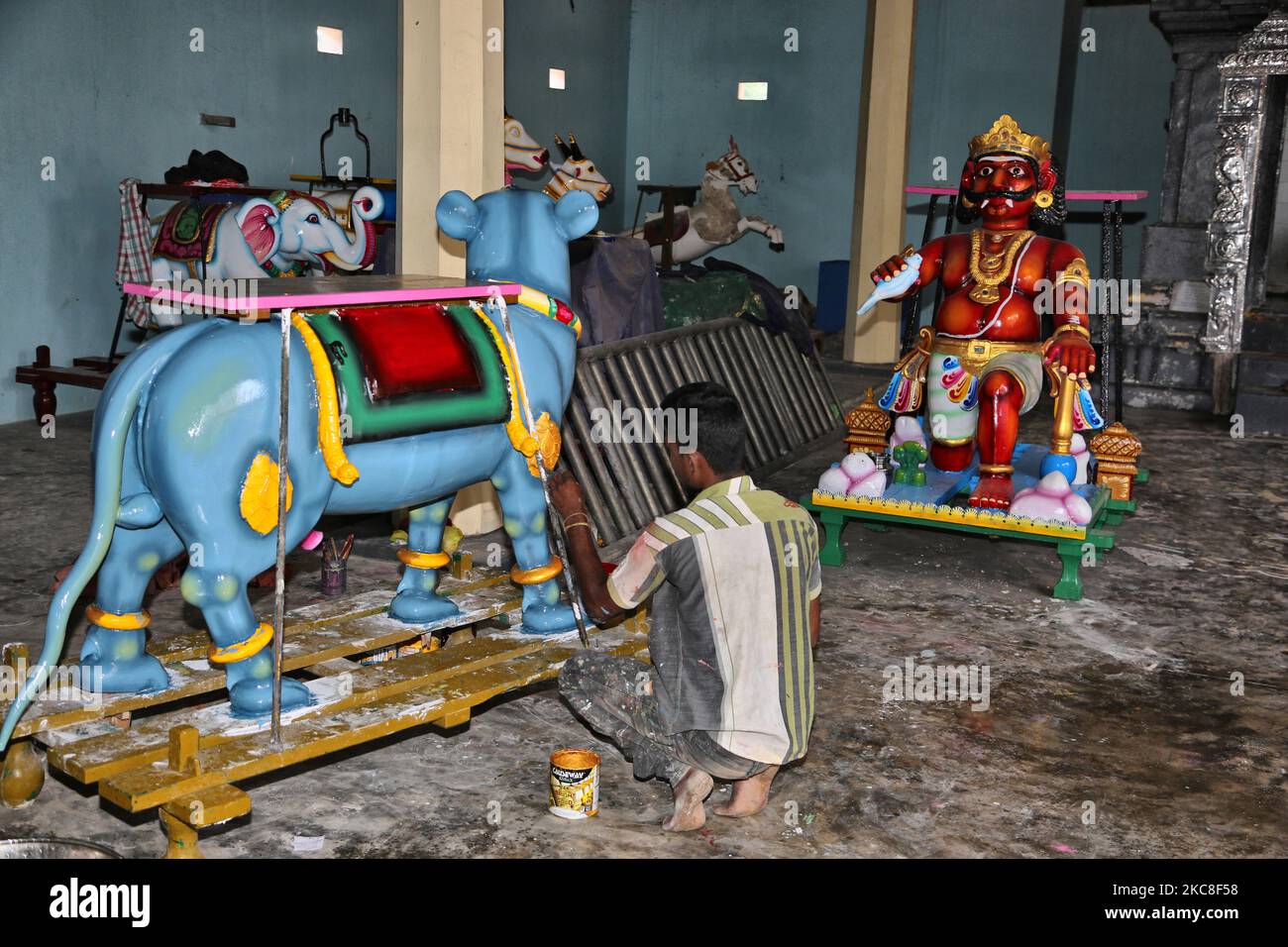 Artisan paints a large Vahana of a rat the Arasadi Vinayagar Temple ...