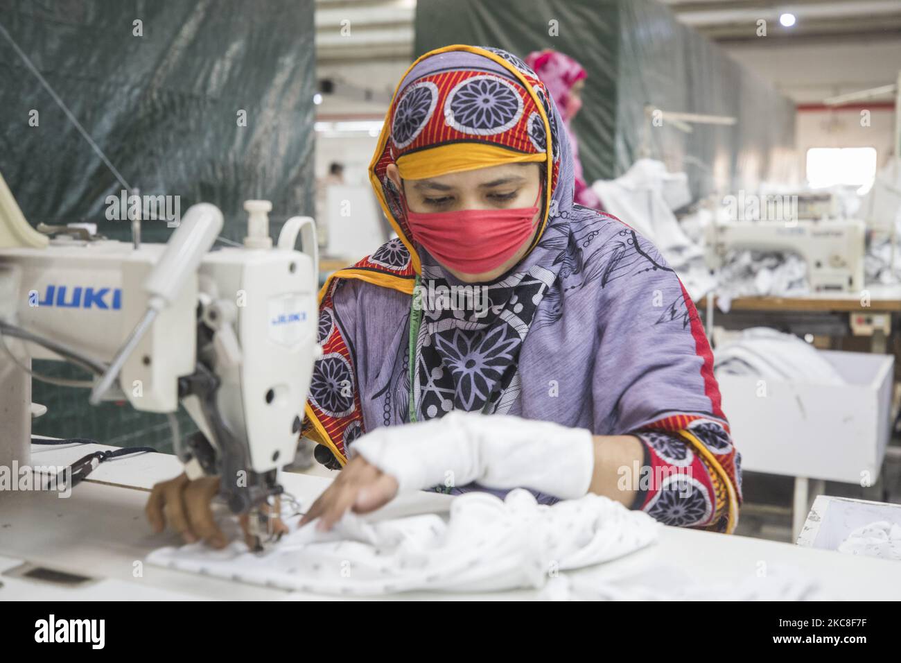 Ready made garments worker works in a garments factory in Narayanganj ...