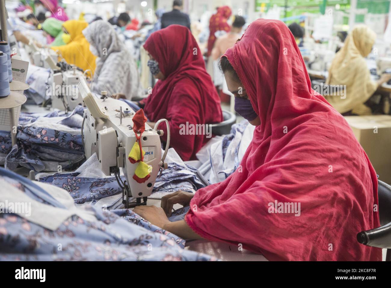 Ready made garments worker works in a garments factory in Narayanganj ...