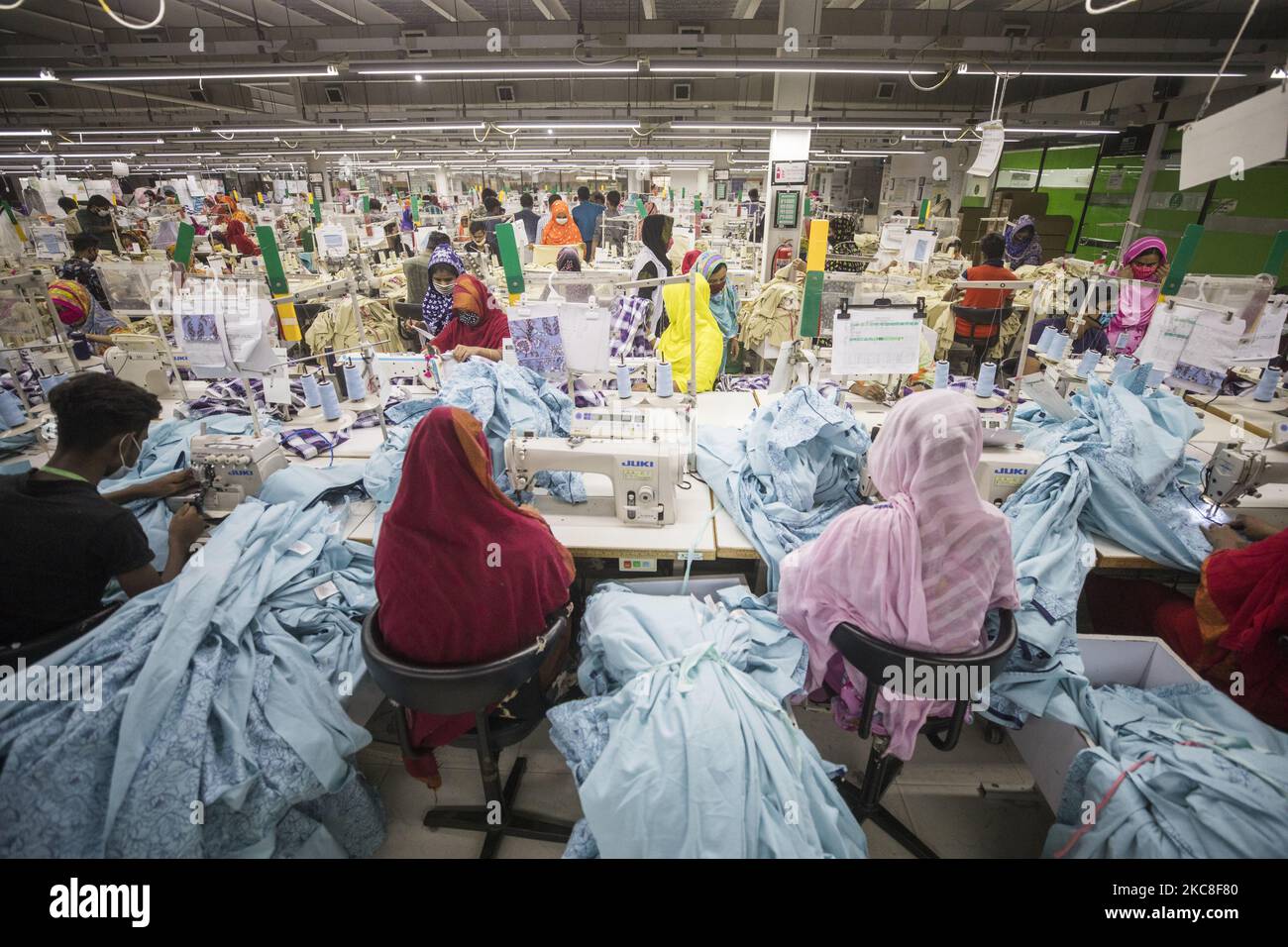 Ready made garments worker works in a garments factory in Narayanganj ...