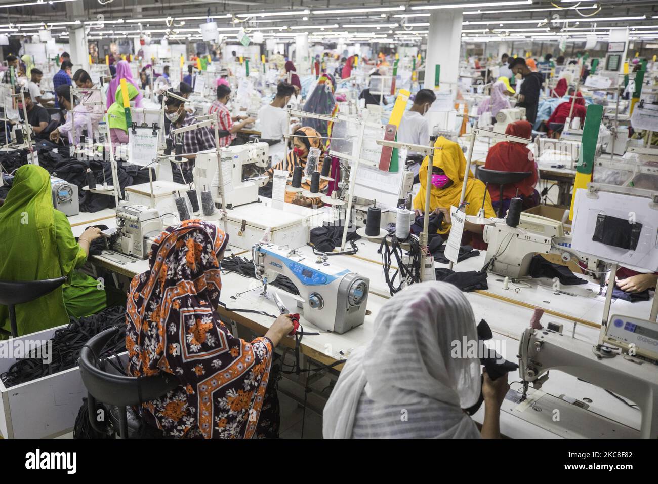 Ready made garments worker works in a garments factory in Narayanganj ...