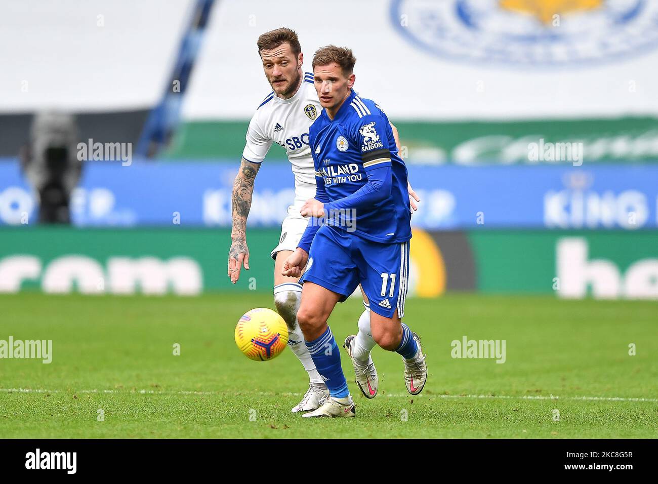 Marc Albrighton of Leicester City shields the ball from Liam Cooper of ...