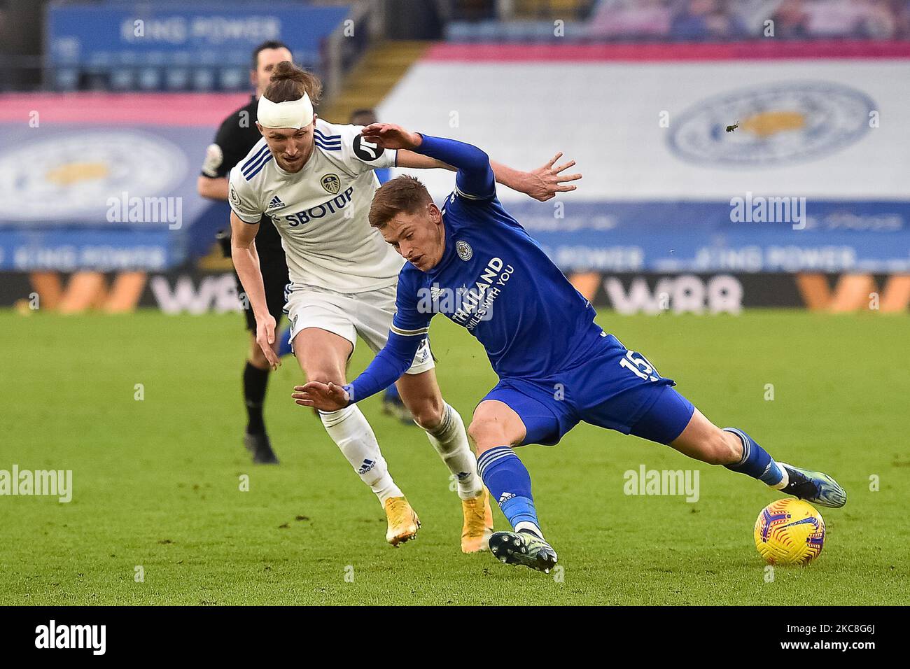Harvey Barnes of Leicester City shields the ball from Luke Ayling of ...