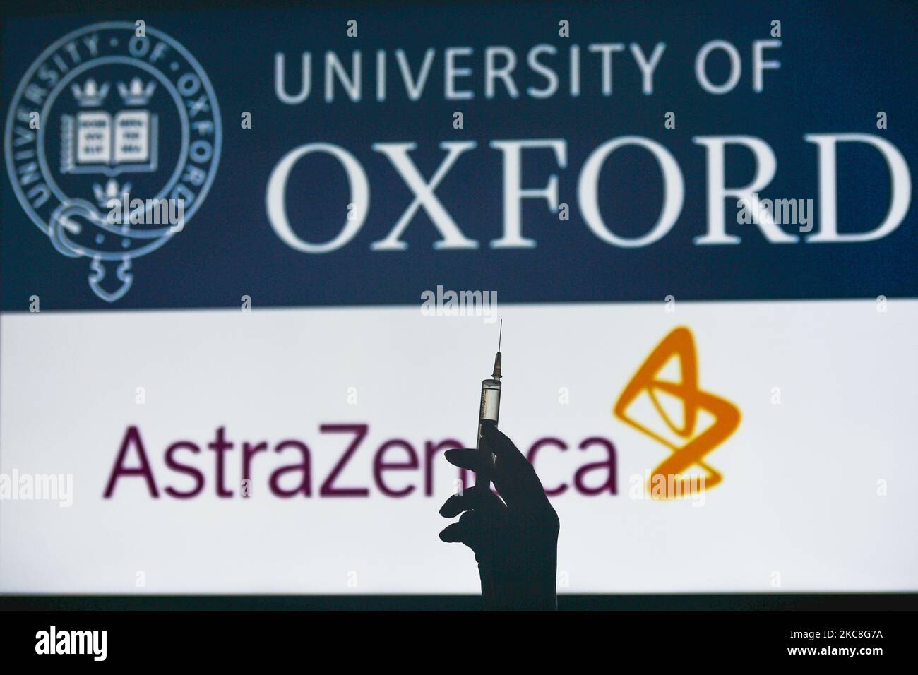 An illustrative image of a hand holding a medical syringe in front of ...