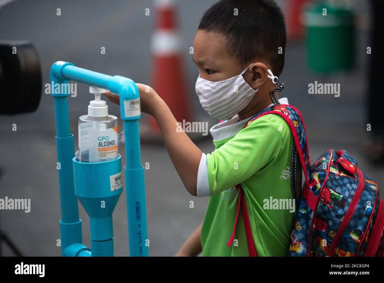 An elementary school student wearing a face mask as a preventive ...